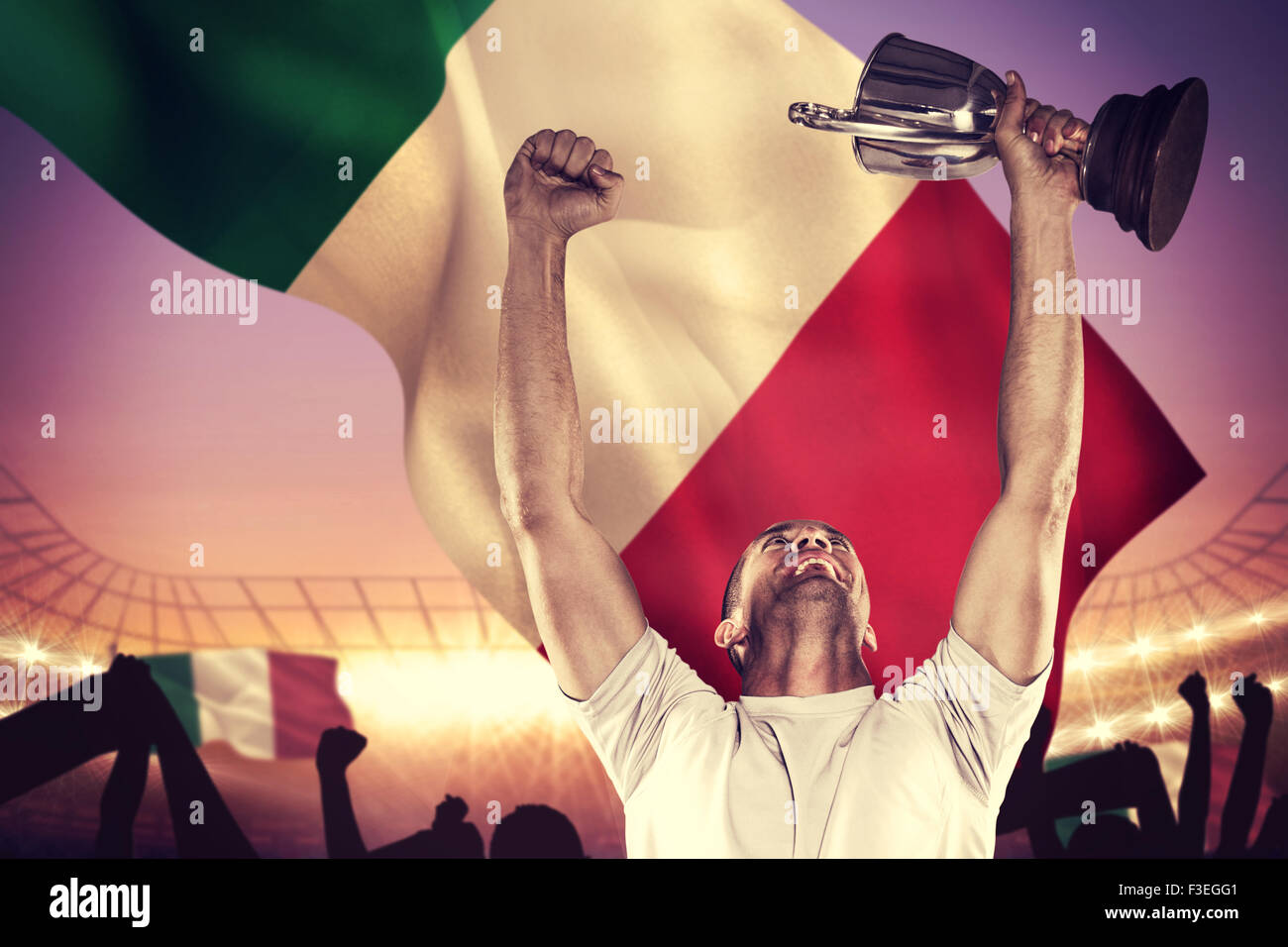 Composite image of happy rugby player holding trophy Stock Photo - Alamy