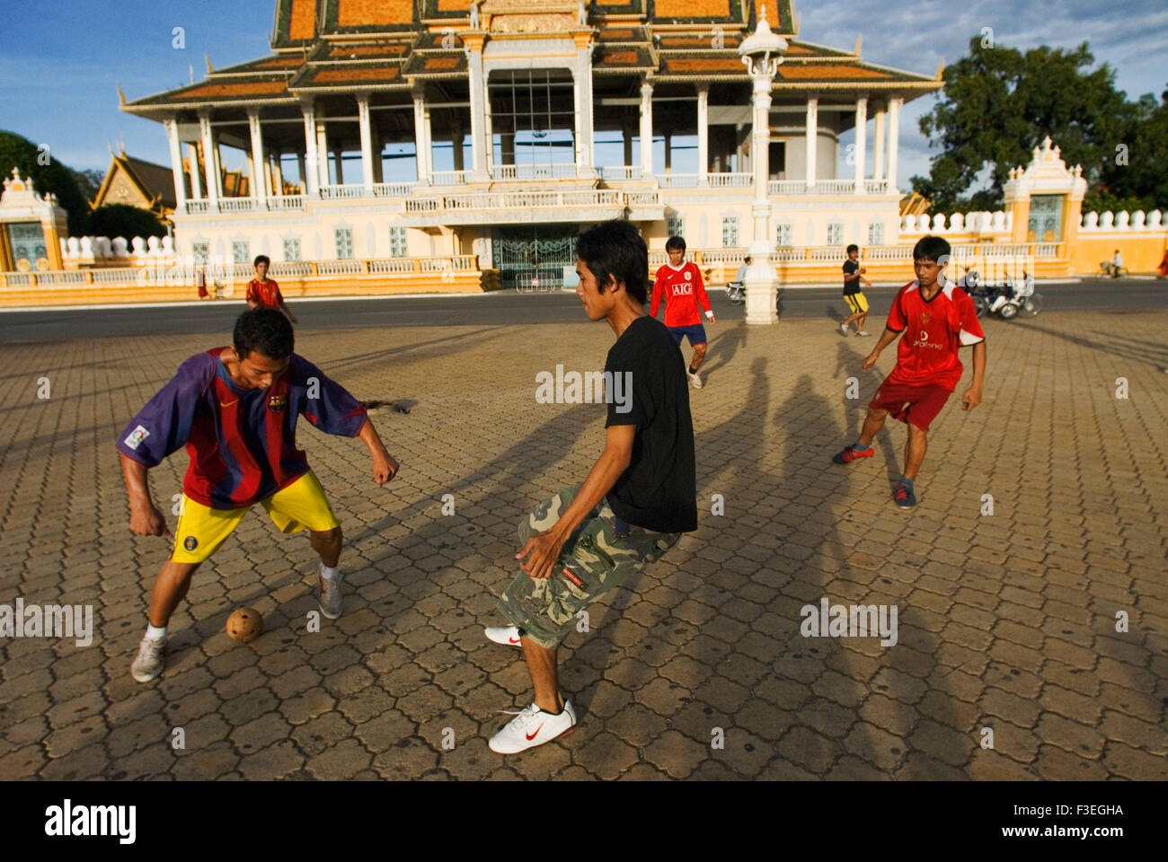 Playing football outside the Royal Palace. Phnom Penh. The Cambodia ...