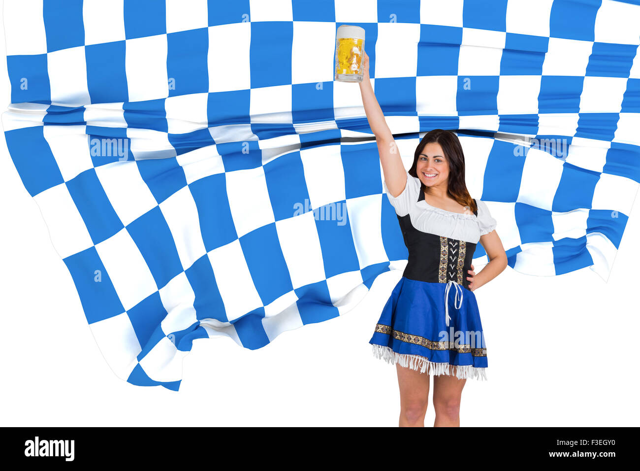 Composite image of pretty oktoberfest girl raising beer tankard Stock ...
