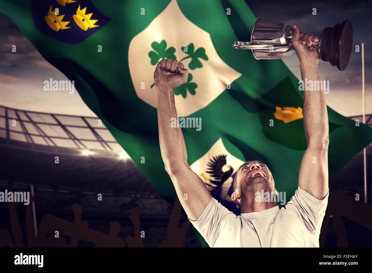 Composite image of happy rugby player holding trophy Stock Photo - Alamy