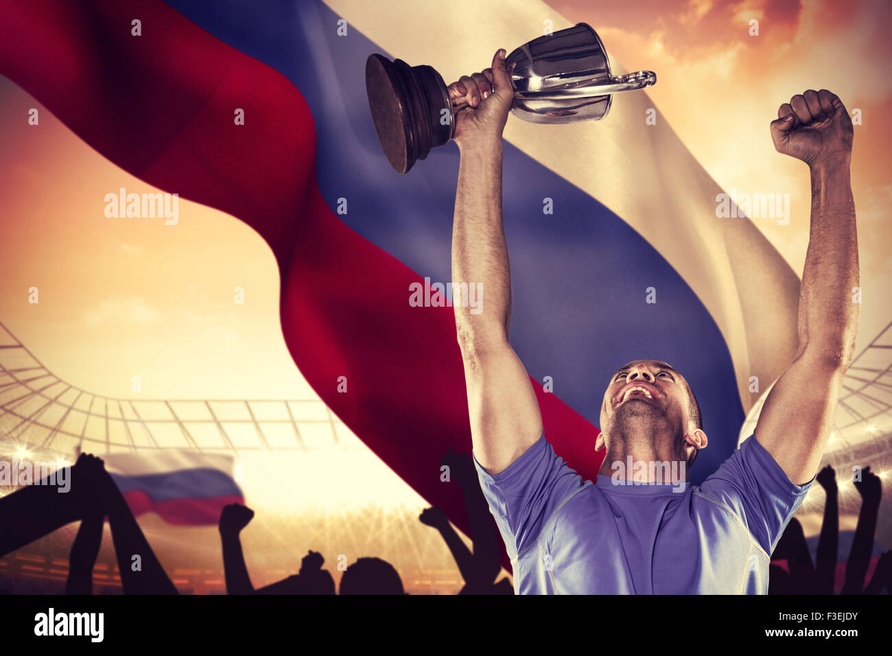 Composite image of happy rugby player holding trophy Stock Photo - Alamy
