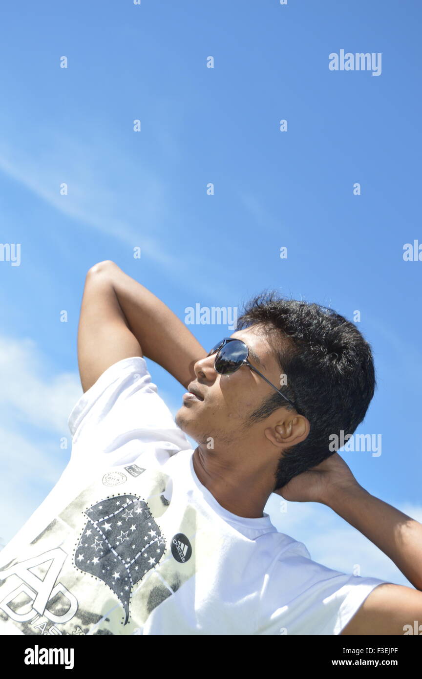 a handsome boy looks at the sky Stock Photo - Alamy