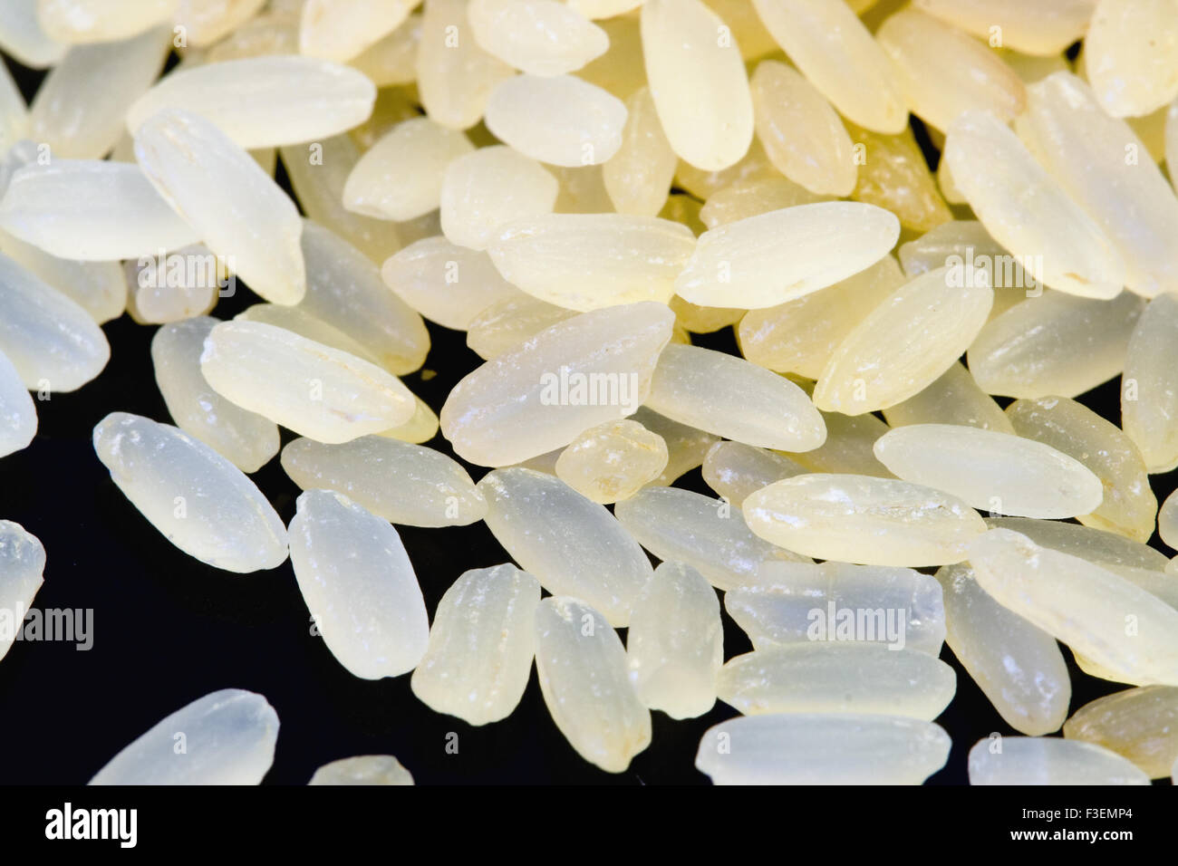 Rice on black background close up Stock Photo - Alamy