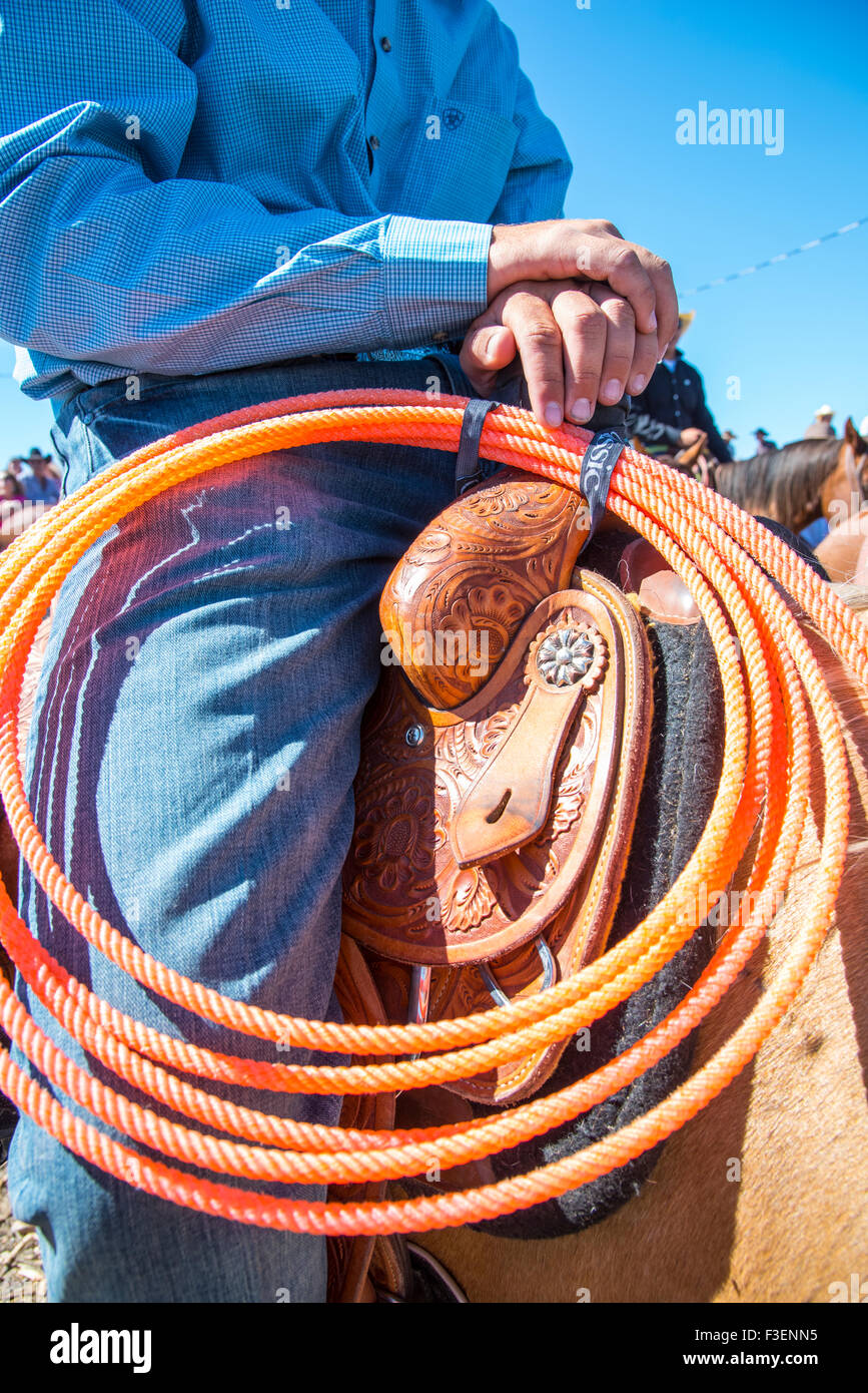 Cowboy holding saddle hi-res stock photography and images - Alamy