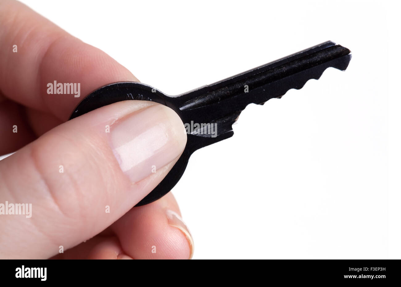Hand holding key Stock Photo - Alamy