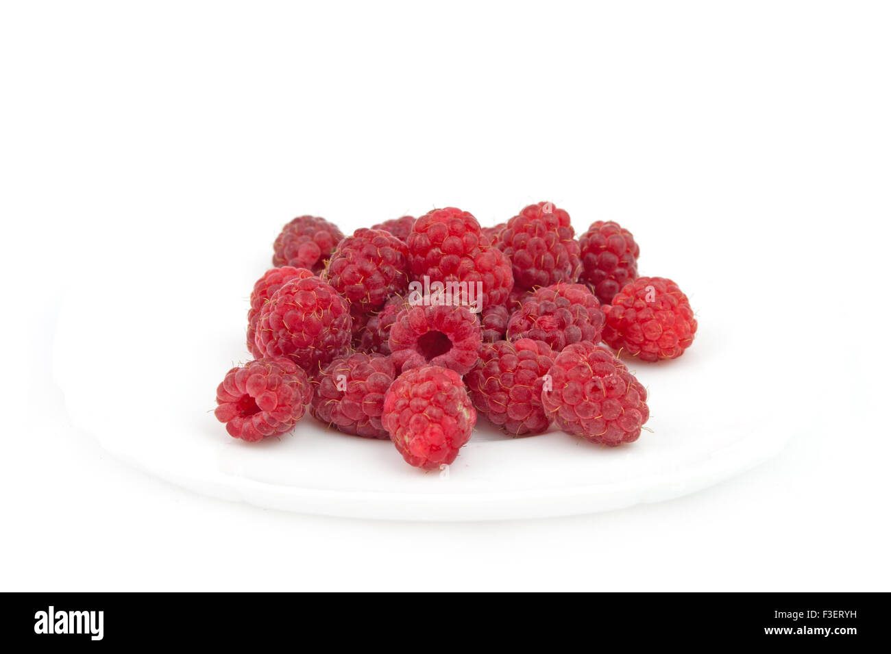 Ripe raspberry on a saucer. Isolated on white background Stock Photo ...
