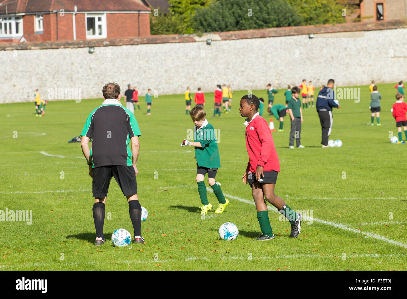 Children playing football school uk High Resolution Stock Photography ...