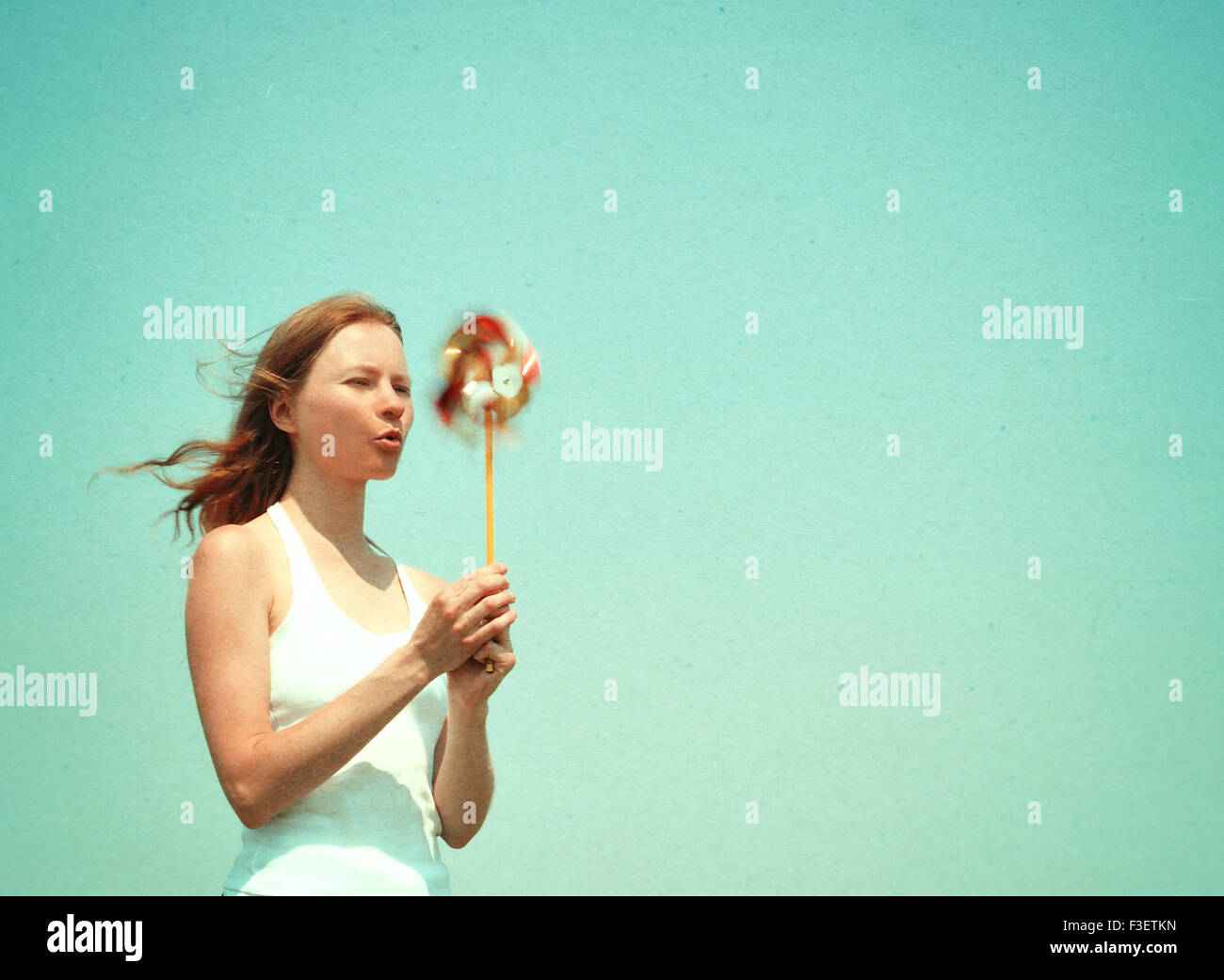Girl with a pinwheel hi-res stock photography and images - Alamy
