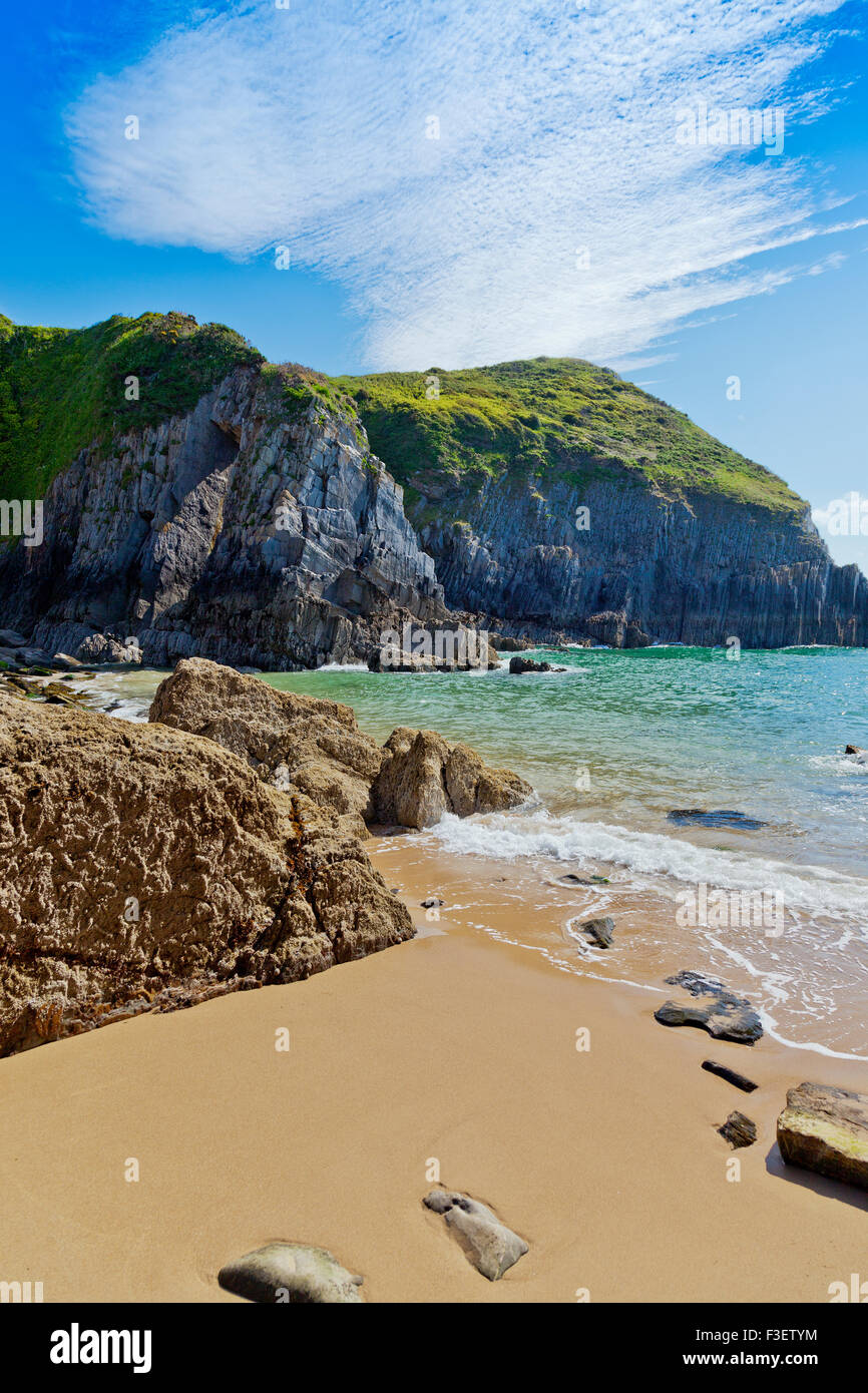 The dramatic coastal scenery and deserted beach at Skrinkle Haven in ...