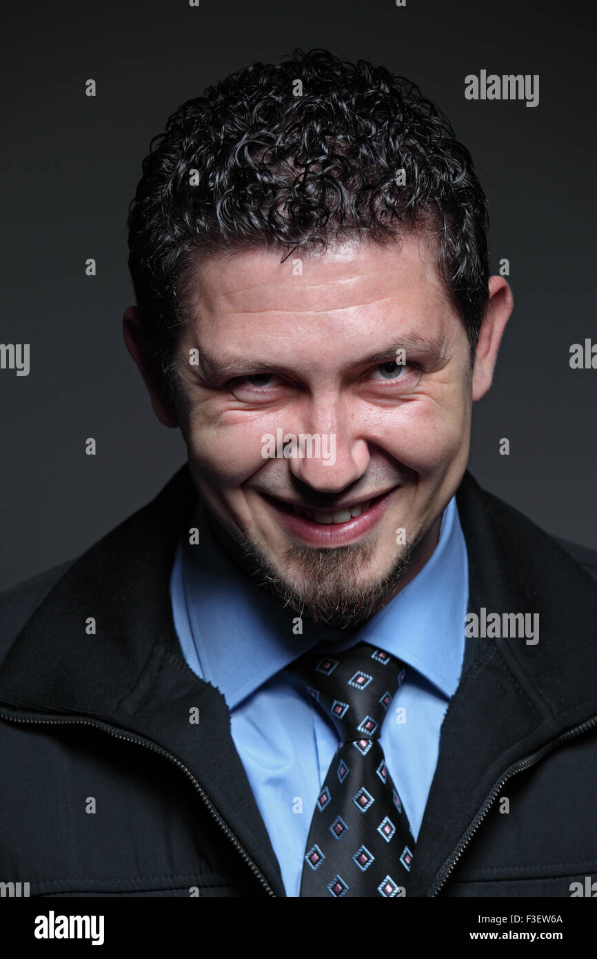 Guy emerging from the shadows Stock Photo - Alamy