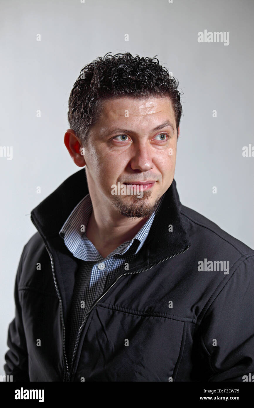 Thinking Young Man on the gray background Stock Photo - Alamy