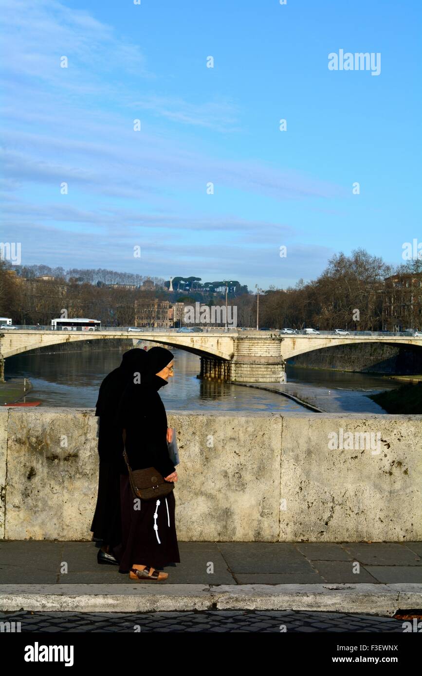 Two nuns crossing a bridge in Trastevere, Rome Italy Stock Photo - Alamy