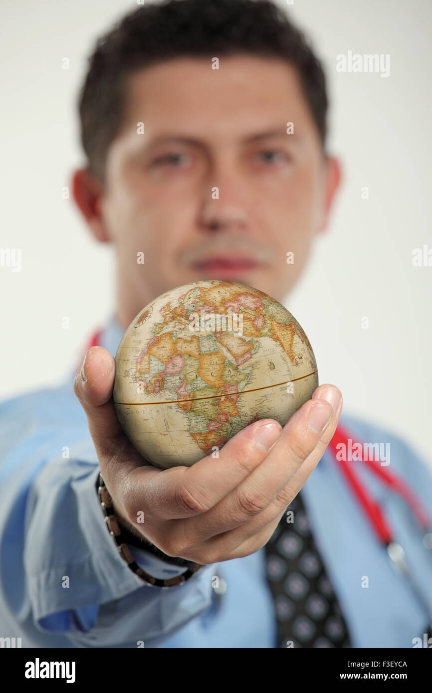 Doctor holding the world in his hands. Concept for global health ... Doctor holding the world in his hands. Concept for global health ...