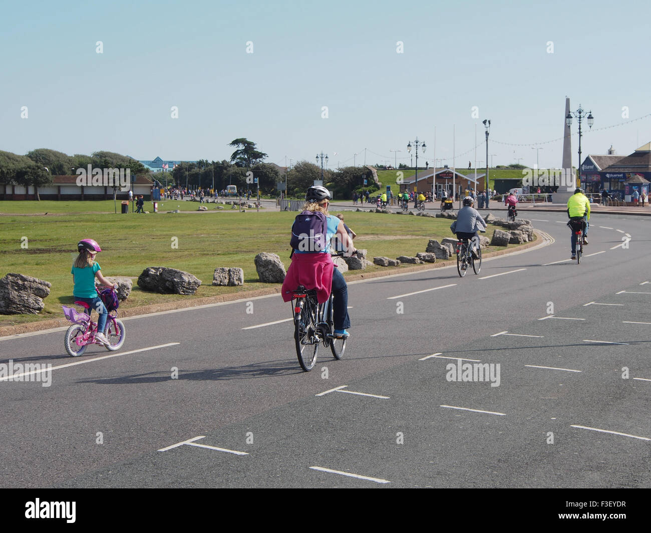 A family cycling on road Stock Photo - Alamy