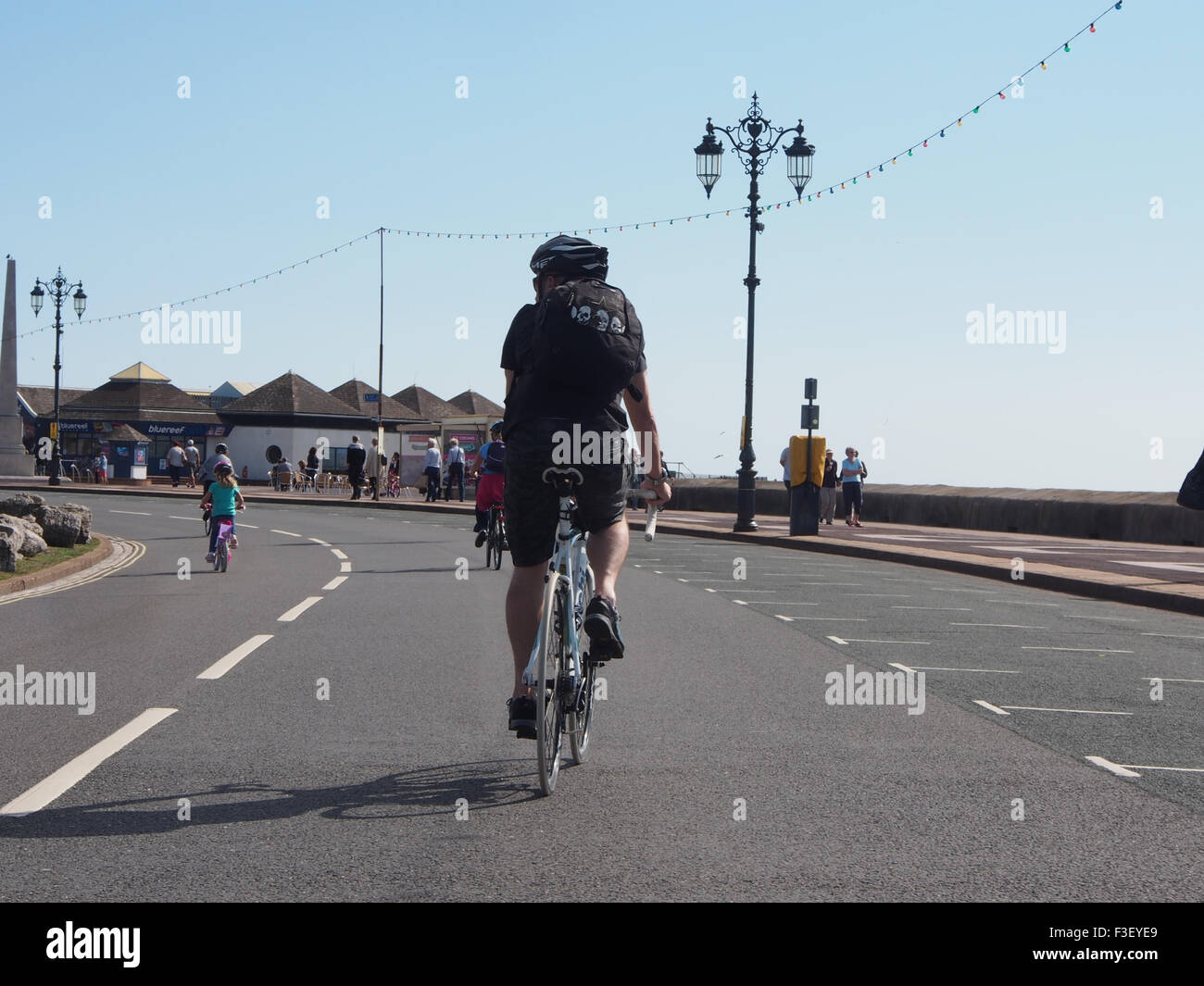 People cycling on road Stock Photo - Alamy