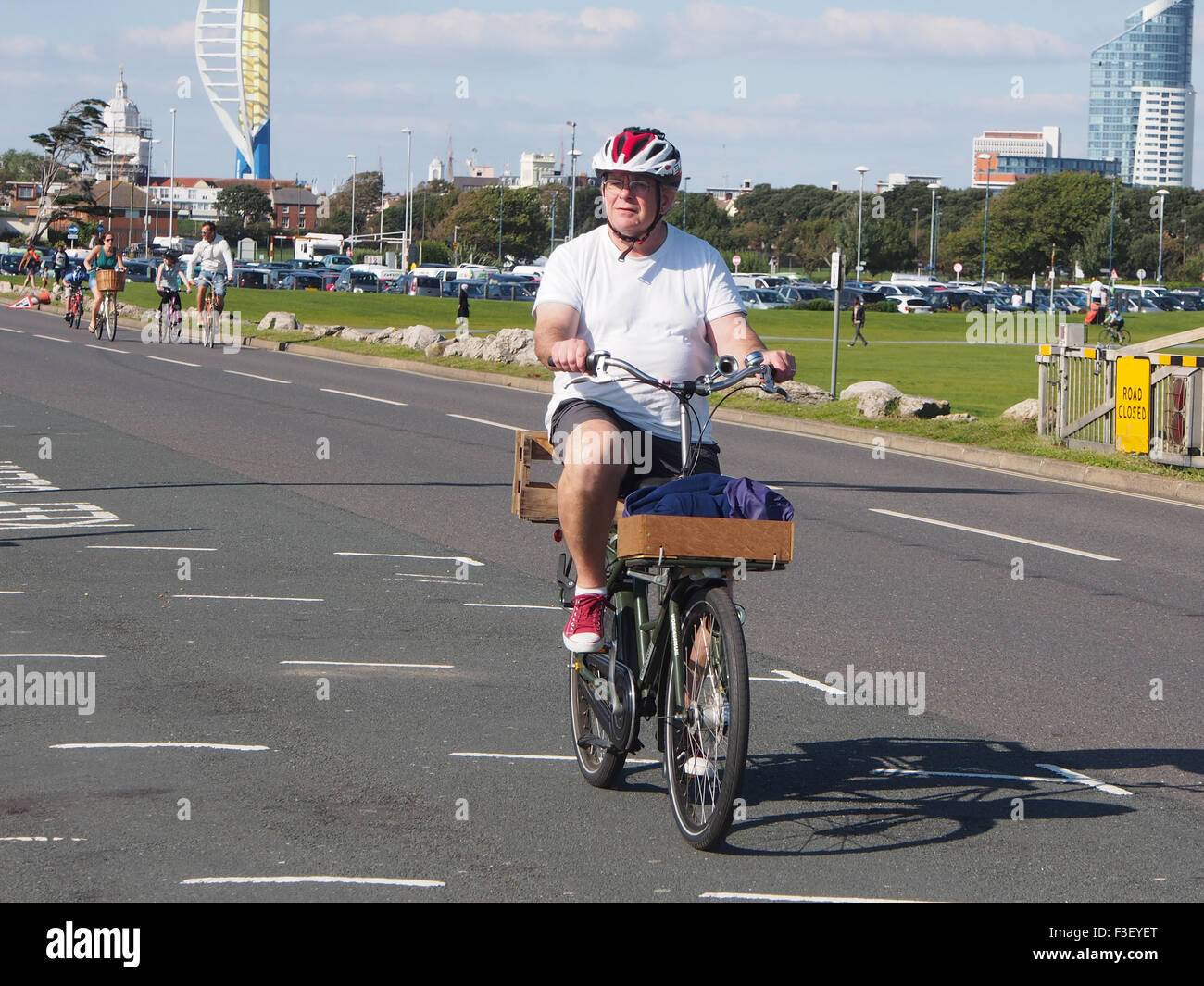 People cycling on road Stock Photo - Alamy