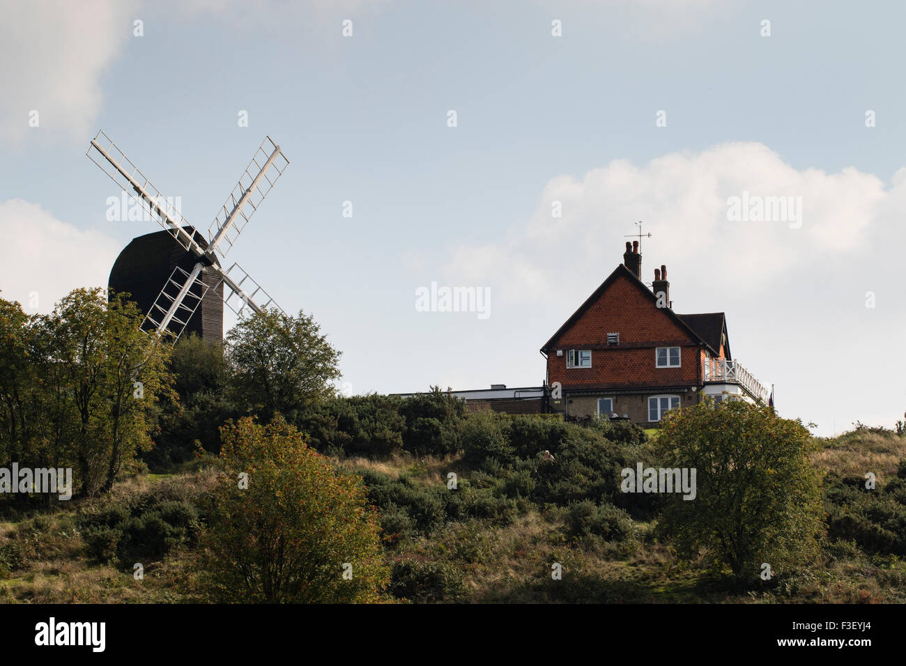 Reigate Heath golf course clubhouse and windmill Stock Photo - Alamy
