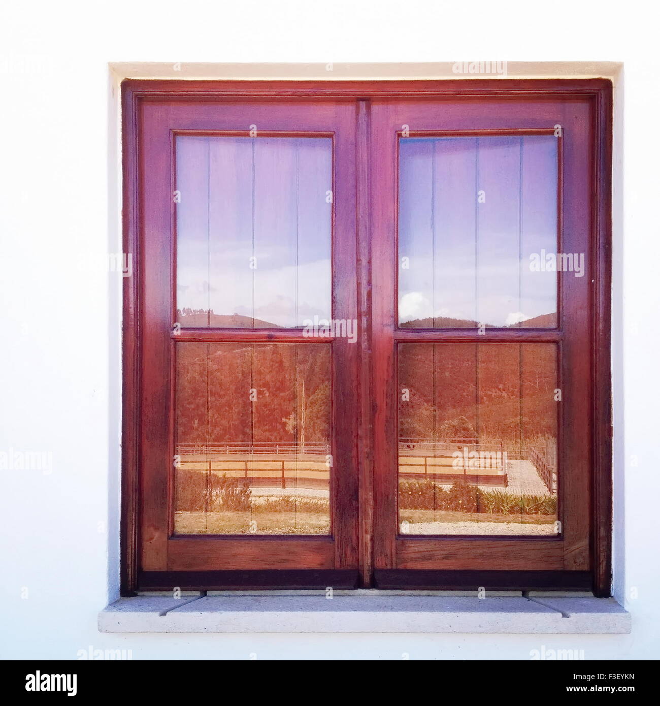 Square closed wood window on bright white wall with background ...