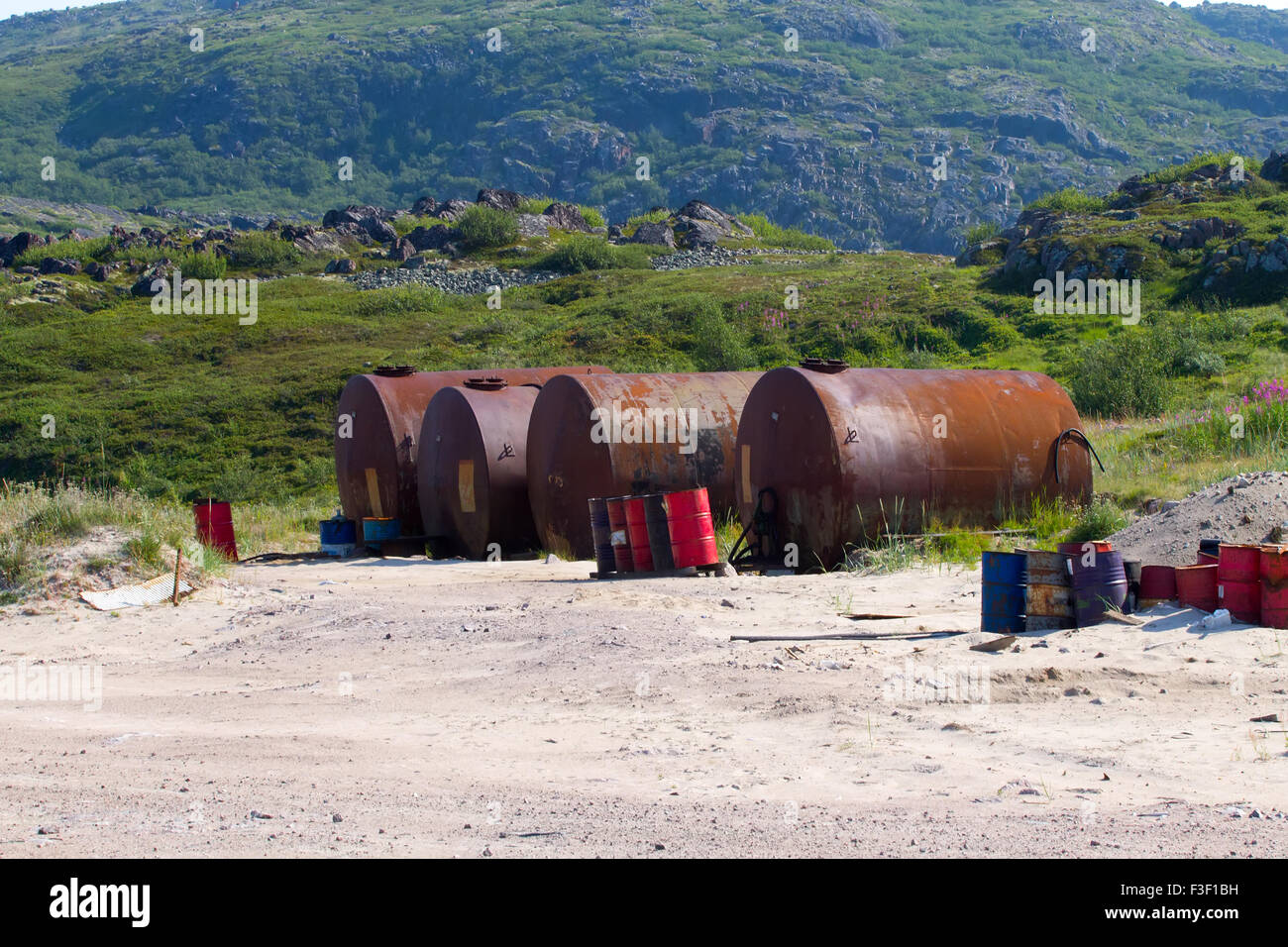 empty barrels in the Arctic environmental pollution Stock Photo - Alamy