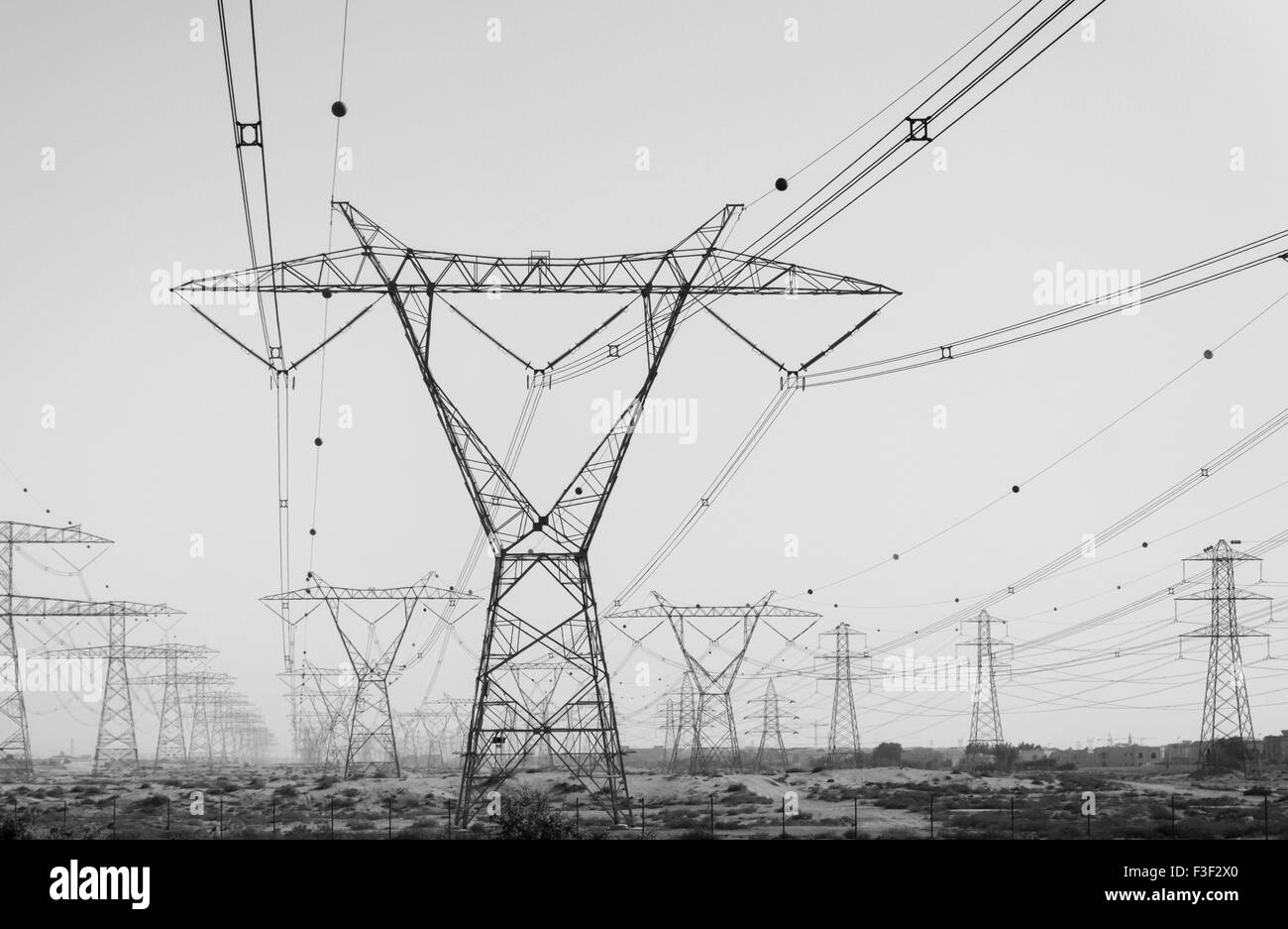 High voltage pylons running through the desert in Dubai UAE on ...