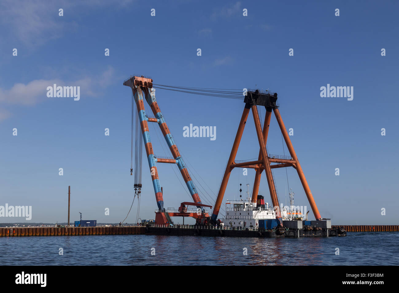Swimming construction crane Stock Photo - Alamy