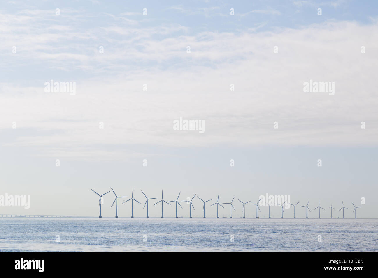 Wind power plants in the morning haze Stock Photo - Alamy