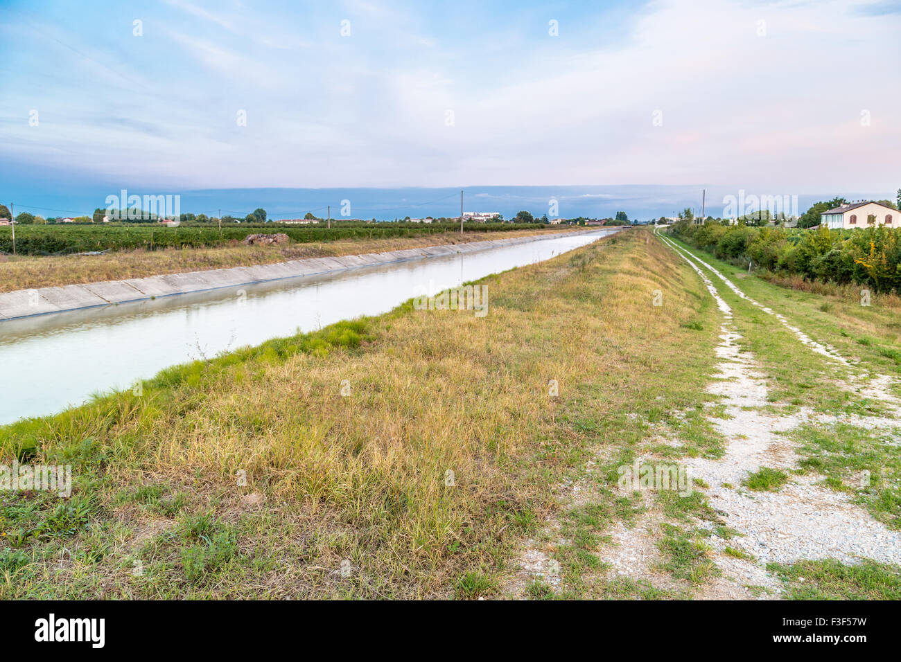 Channel to divert river water for irrigation of cultivated fields Stock ...