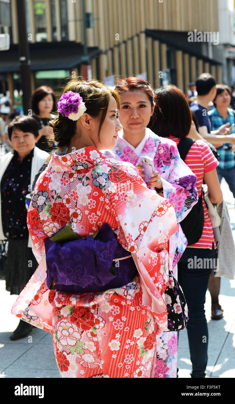 Young Japanese women dressed in colorful traditional Kimono dresses ...