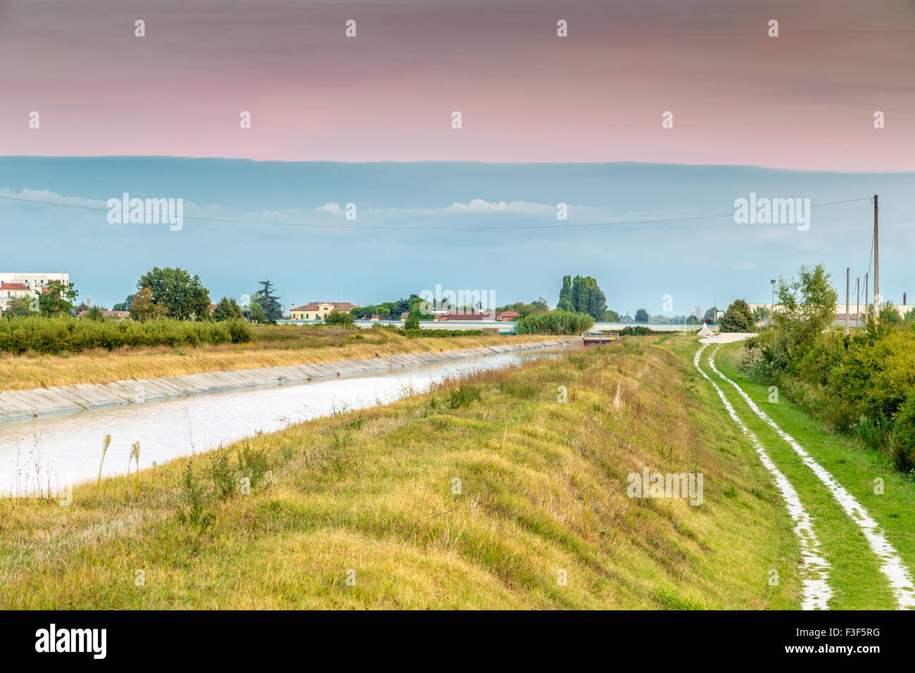 Channel to divert river water for irrigation of cultivated fields Stock ...