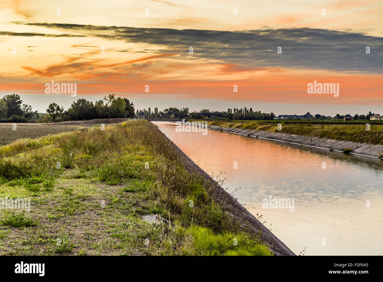 Channel to divert river water for irrigation of cultivated fields Stock ...