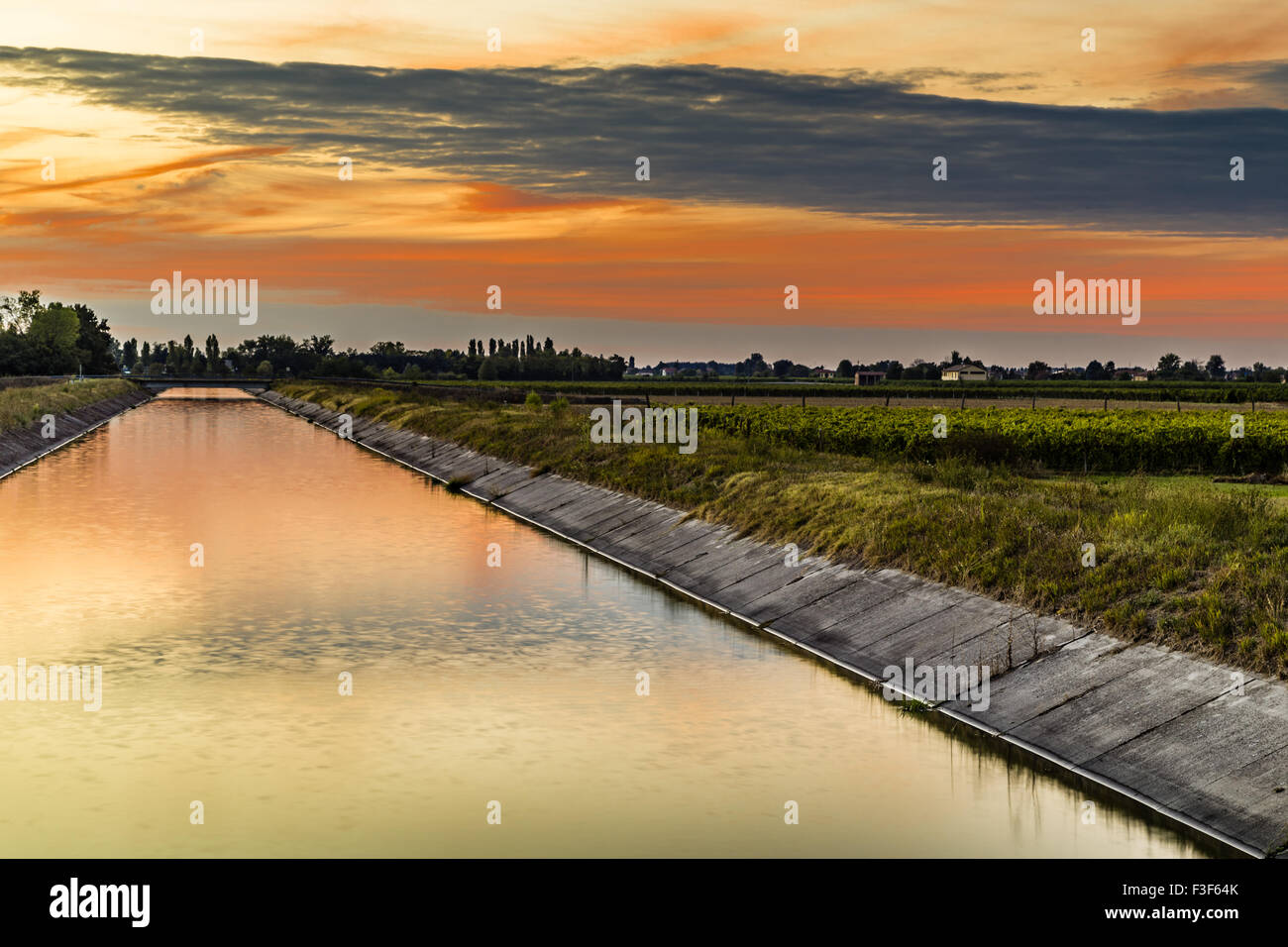 Channel to divert river water for irrigation of cultivated fields Stock ...