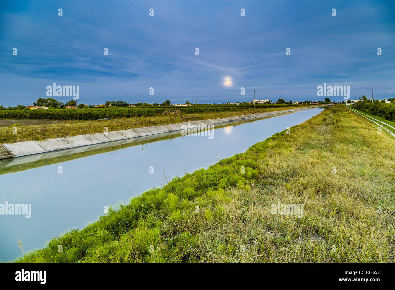 Channel to divert river water for irrigation of cultivated fields Stock ...