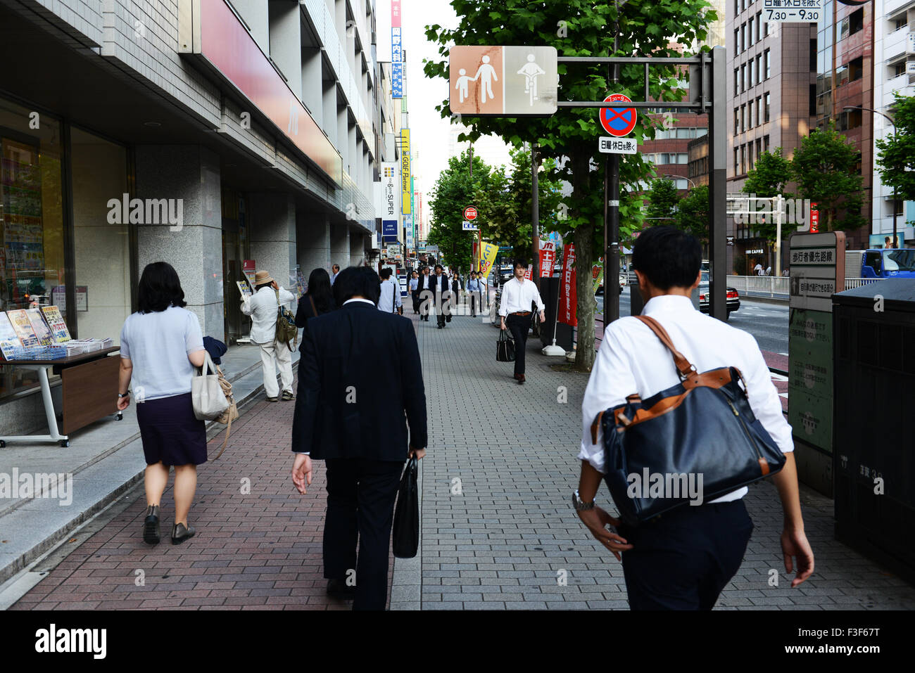 Busy sidewalks. After a long day at work people begin their long ...