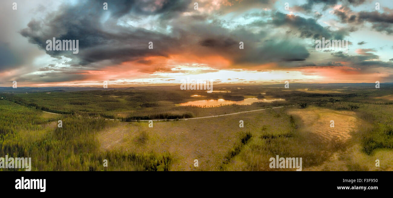 Huge storms colored by sunset above the forests in Sweden, aerial panorama Stock Photo - Alamy