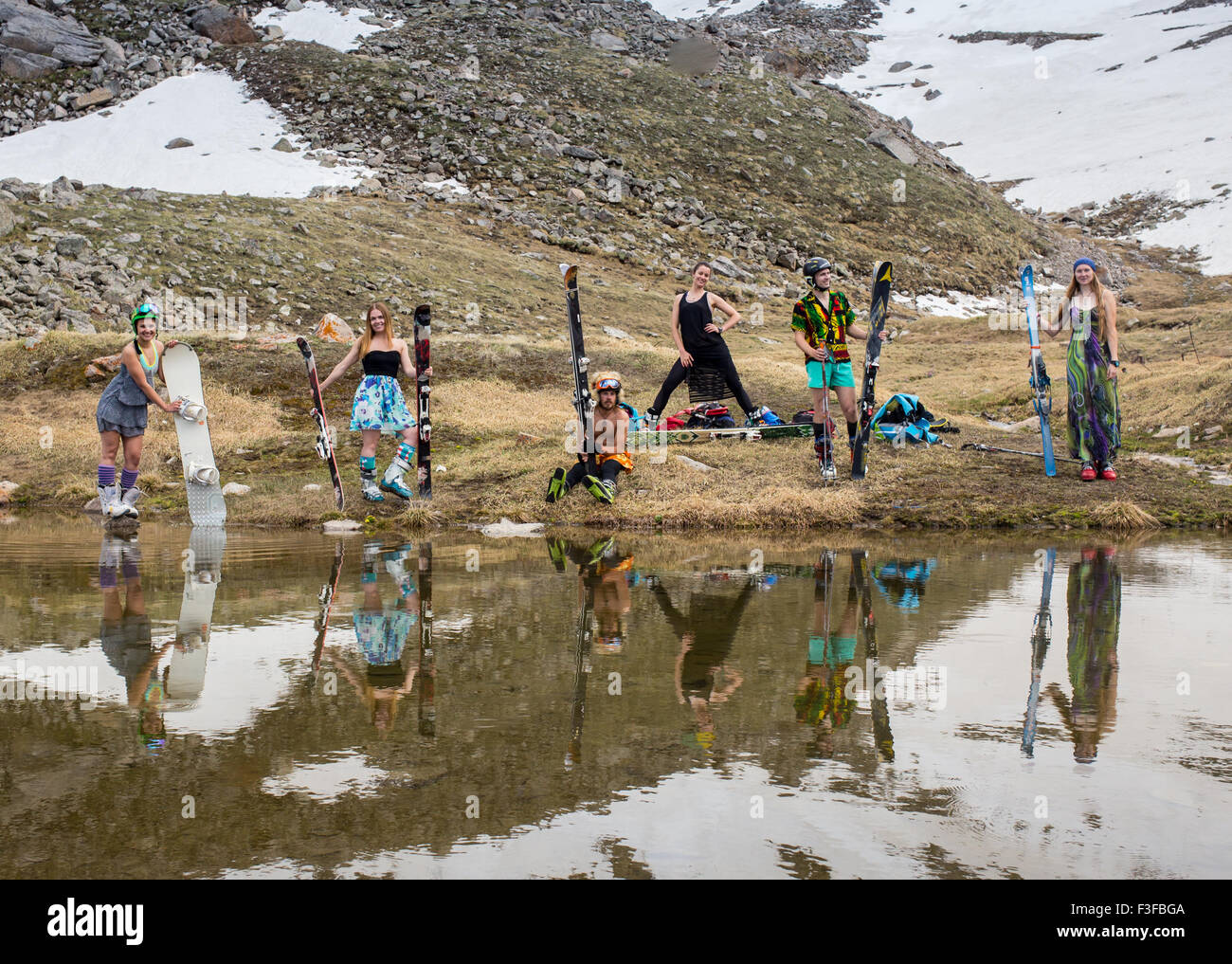 Group of teenagers laid on the snow in wintertime Stock Photo - Alamy