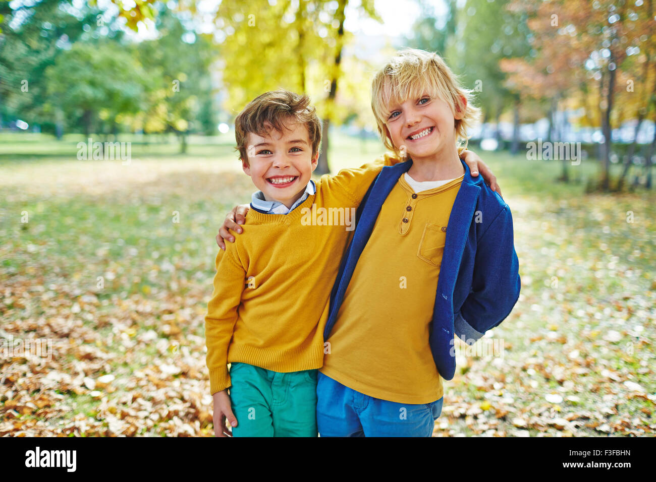 Friendly boys looking at camera in park Stock Photo - Alamy