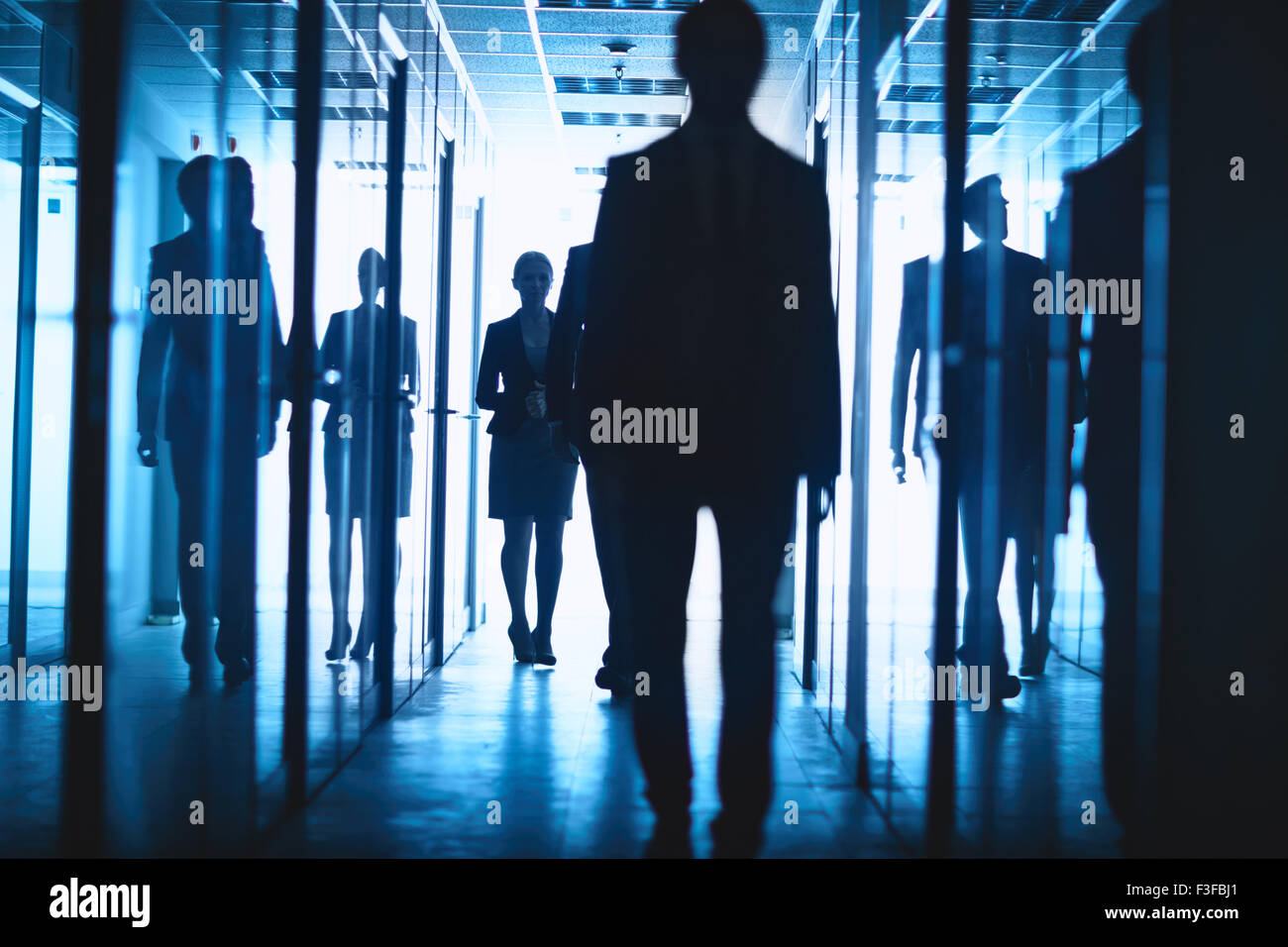 Woman walking down corridor hi-res stock photography and images - Alamy
