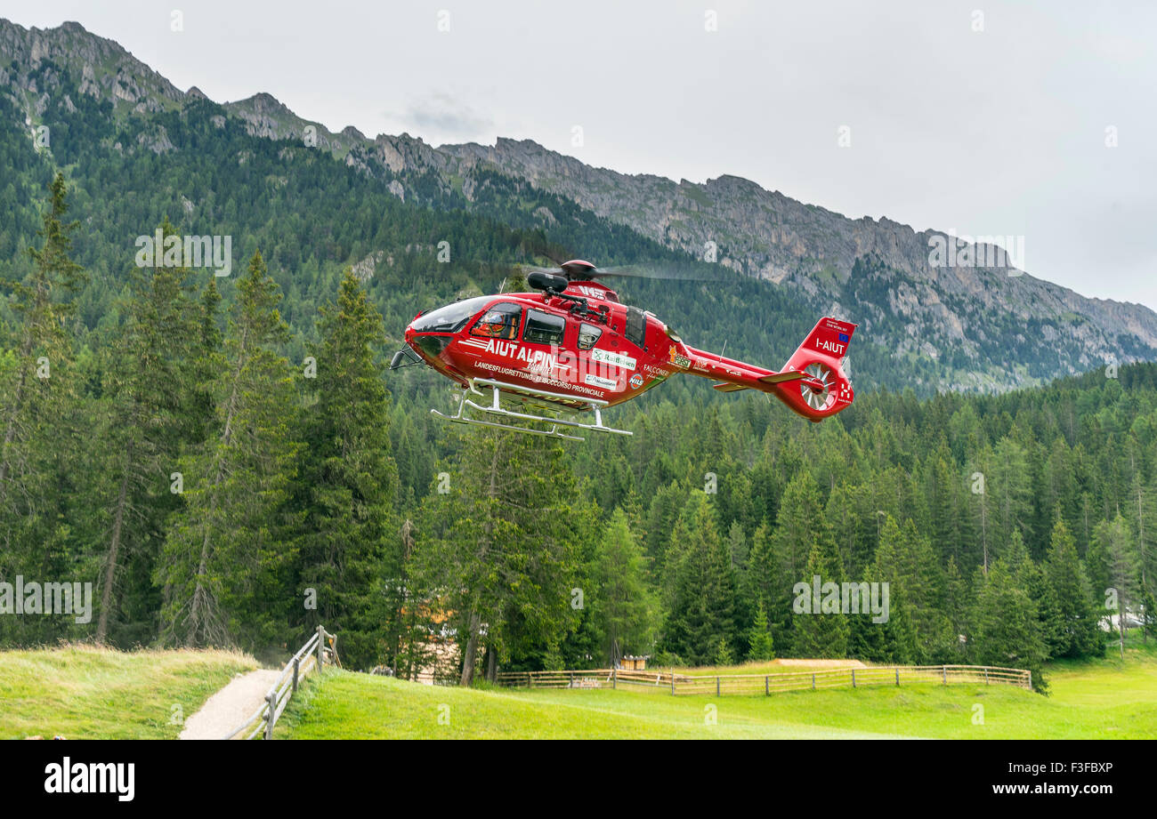 Red Aiut Alpin rescue helicopter I-AIUT taking off from meadow, Airbus ...