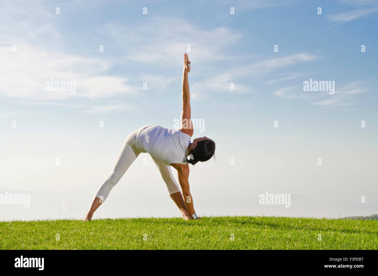 Twisted triangle pose hi-res stock photography and images - Alamy