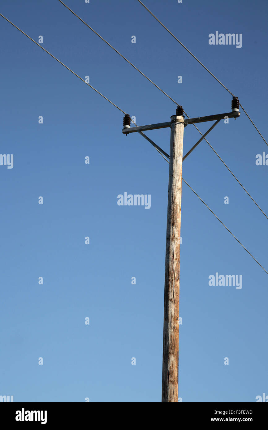 Wooden electric poles with electric wires against blue sky ; Sweden ...