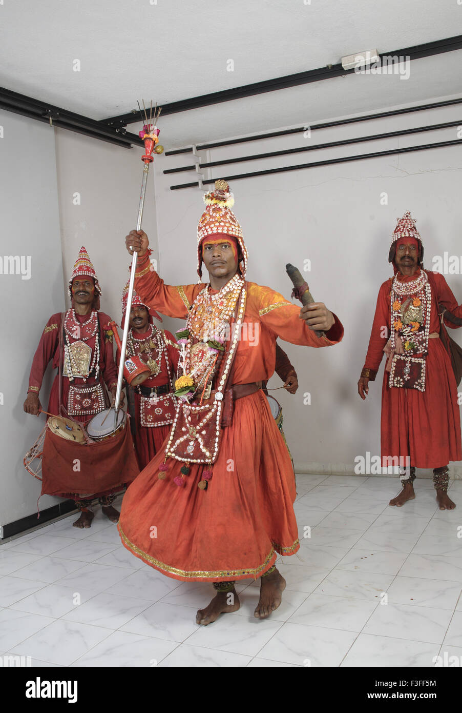 Gondhali from Solapur District playing drums ; Maharashtra ; India MR ...