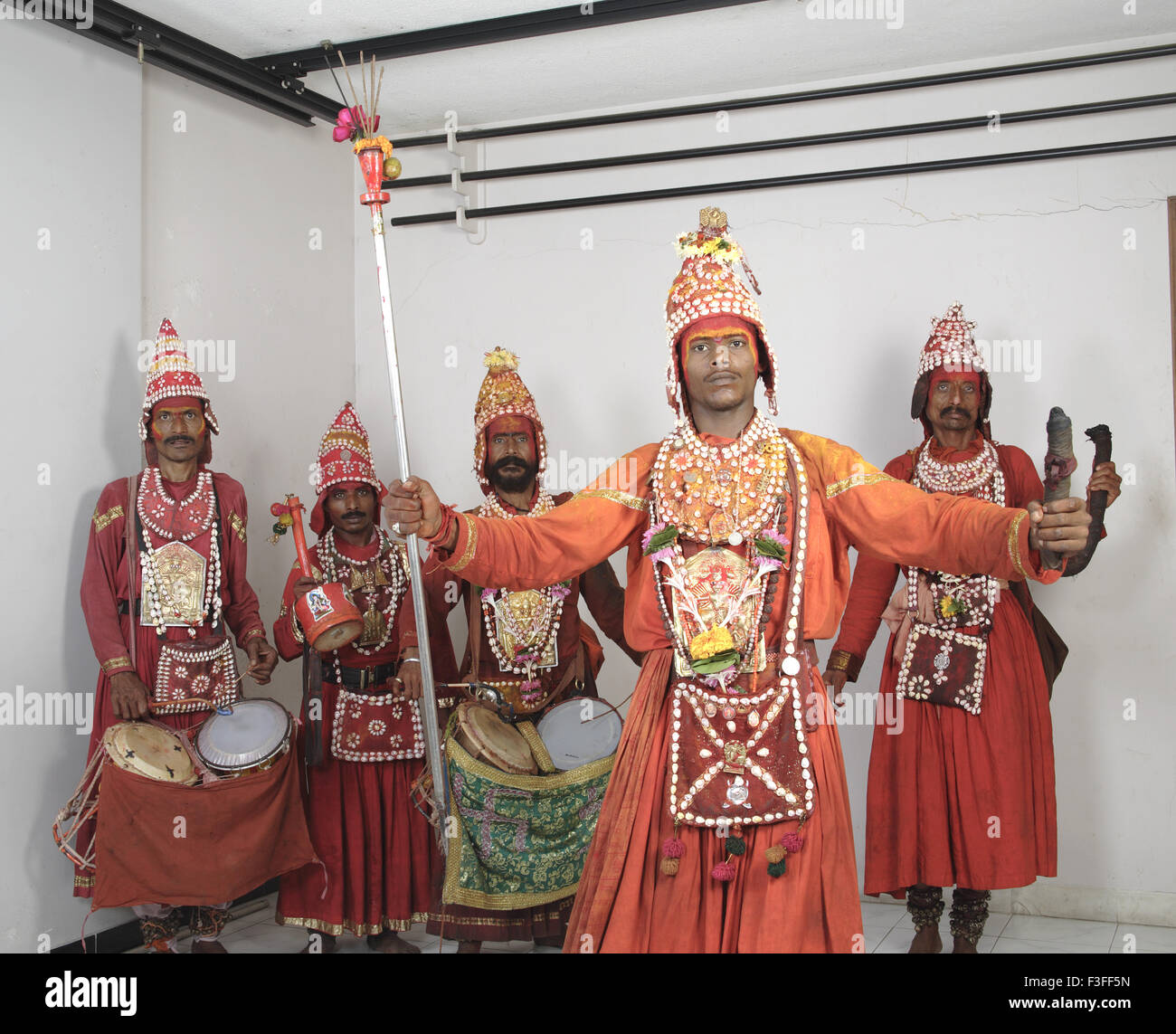 Gondhali from Solapur District playing drums ; Maharashtra ; India MR ...