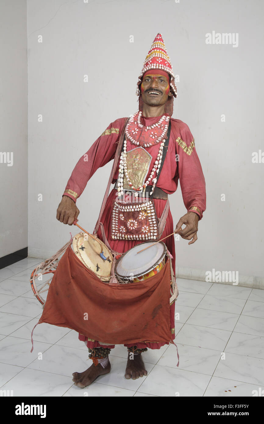 Gondhali from Solapur District playing drums ; Maharashtra ; India MR ...