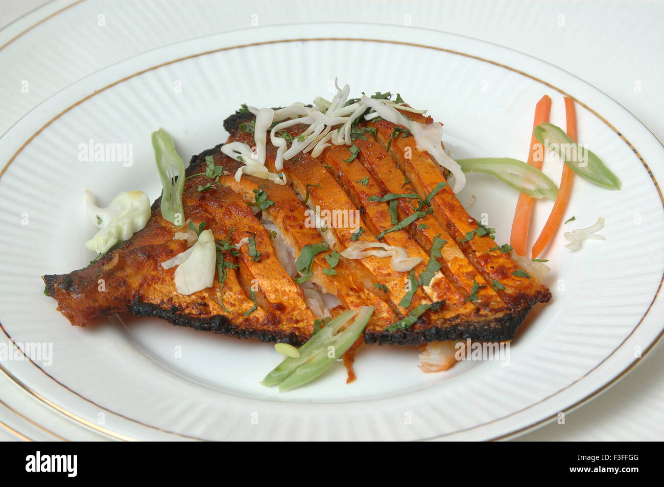 Non Vegetarian ; Fish ; Tandoori Pomfret garnished with cabbage ...