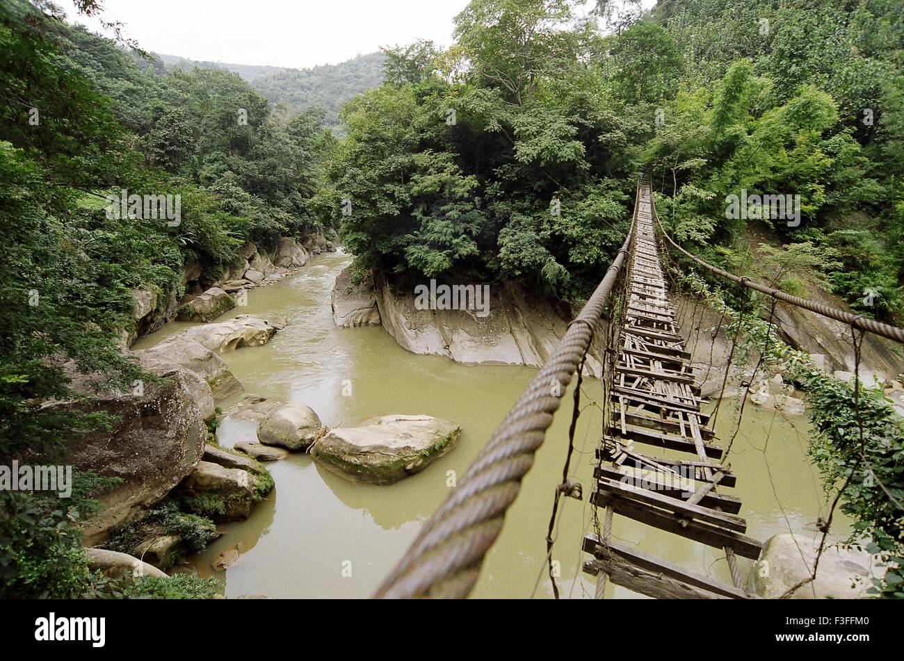Broken bridge over river ; Kullu valley ; Kulu ; Kullu ; Himachal ...