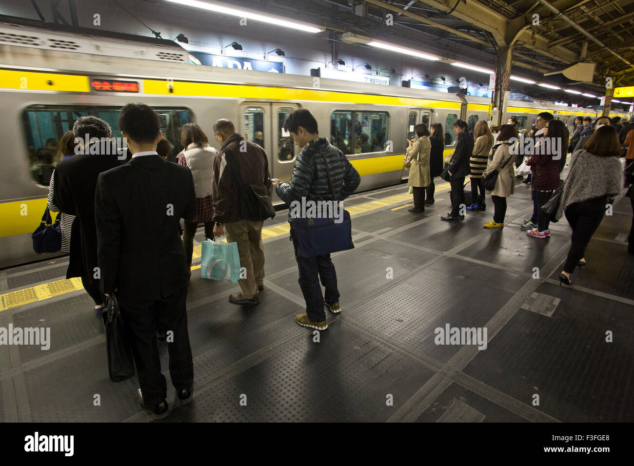 Tokyo queue subway hi-res stock photography and images - Alamy