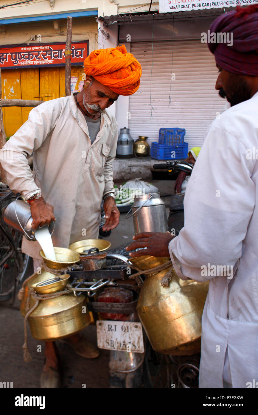 Milkman pouring milk hi-res stock photography and images - Alamy