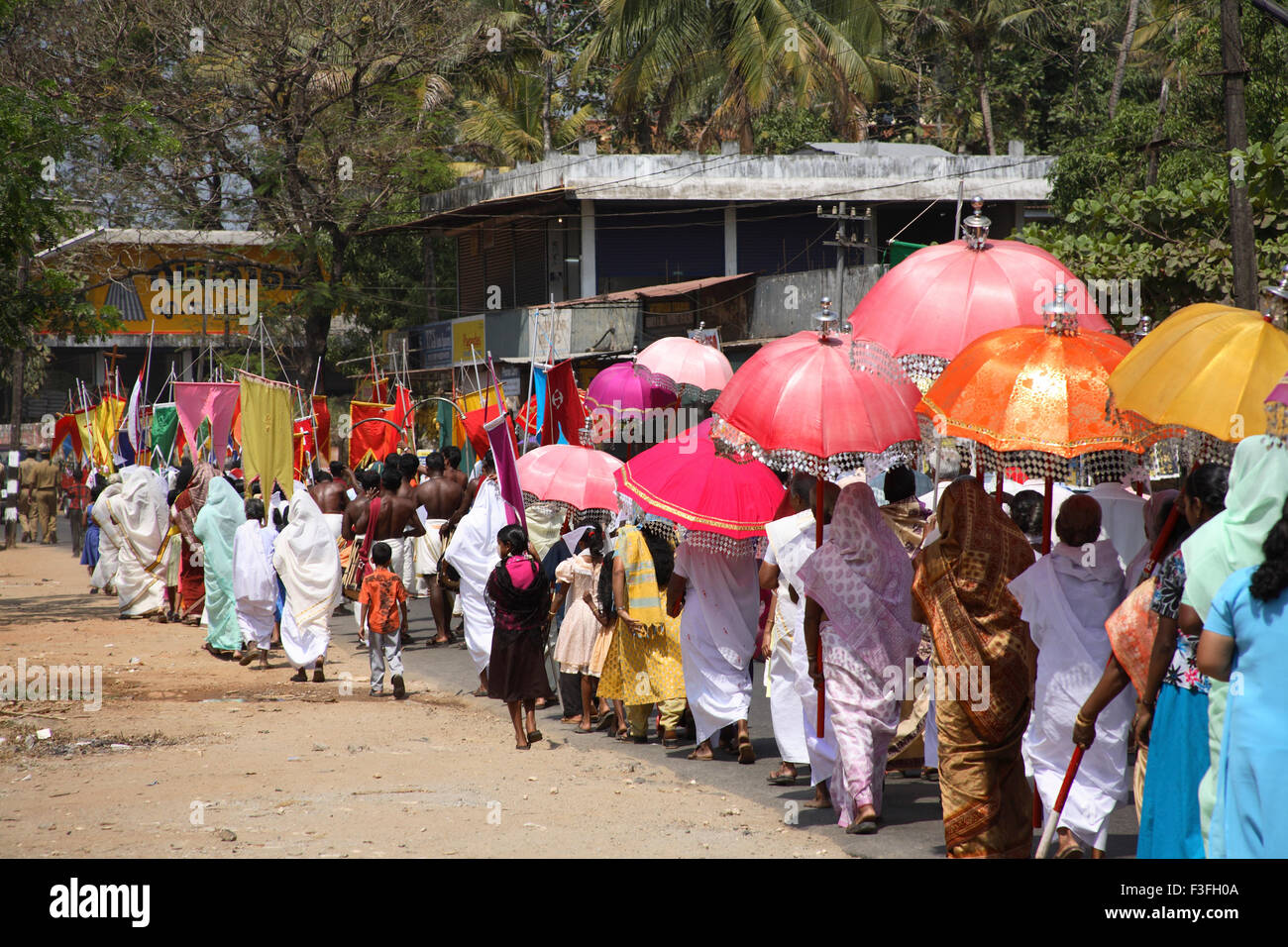 Syrian Christian in procession people umbrellas Marthoman Cheriyapally ...