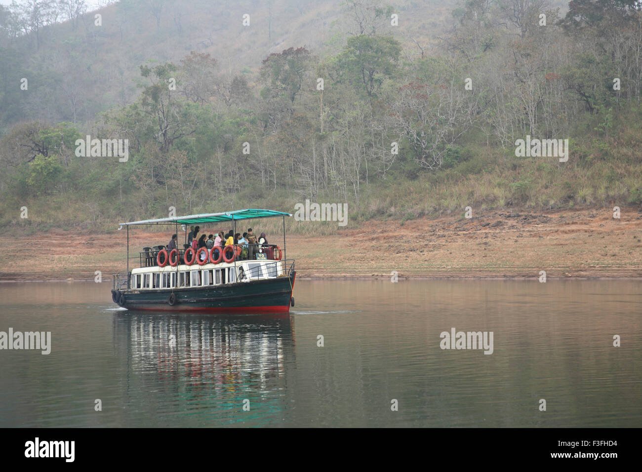 Early morning tourists on boat ride at Periyar lake ; Periyar wildlife ...
