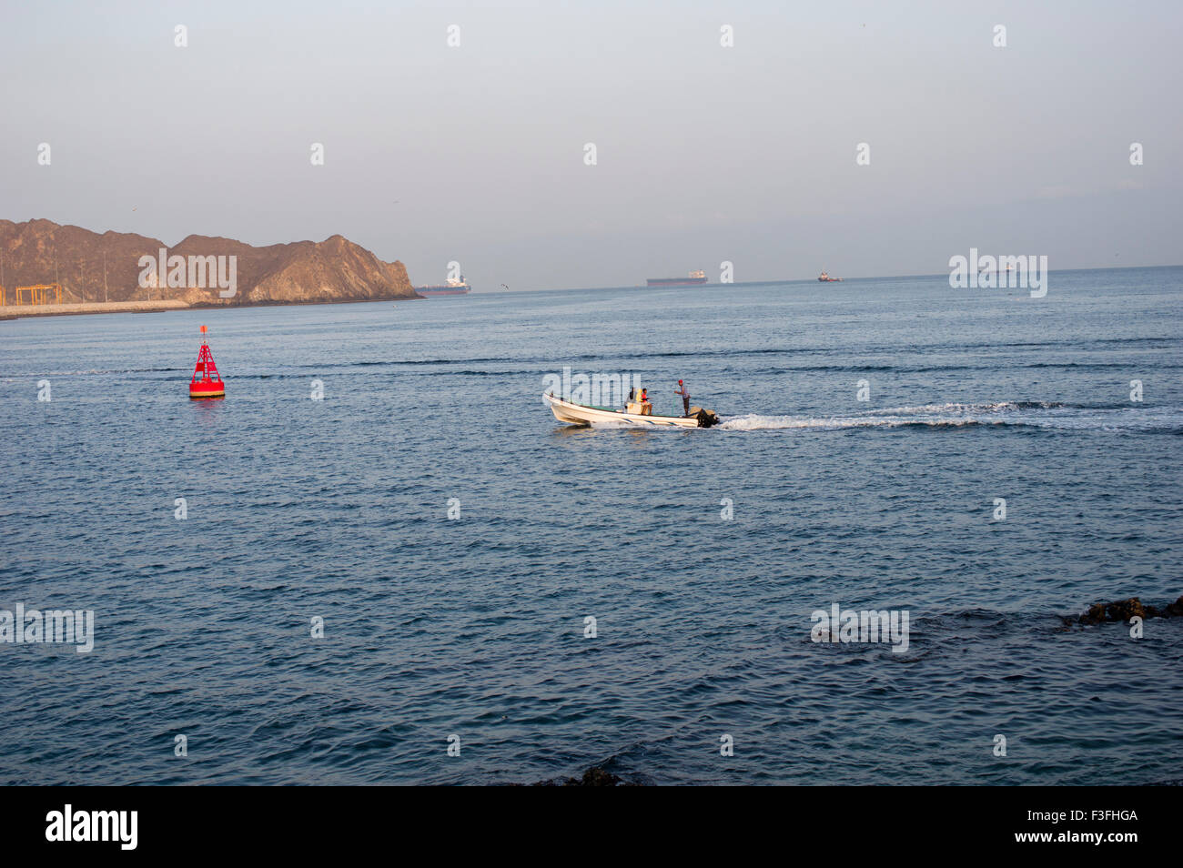 Fishing boat in the harbour of Muscat in the Sultanate of Oman with ...